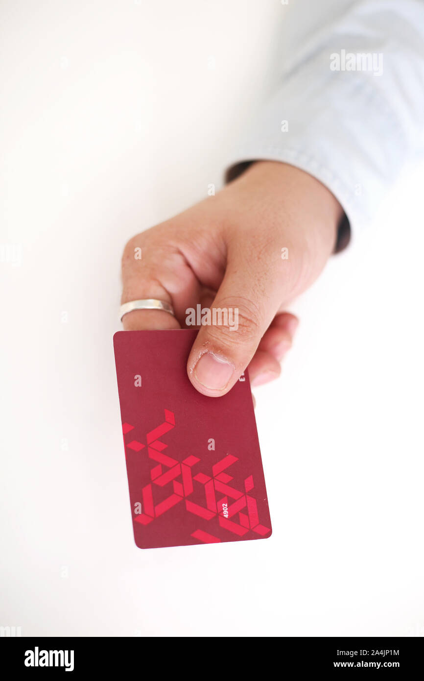Picture of man holding Credit Card in hand. Isolated on white ...