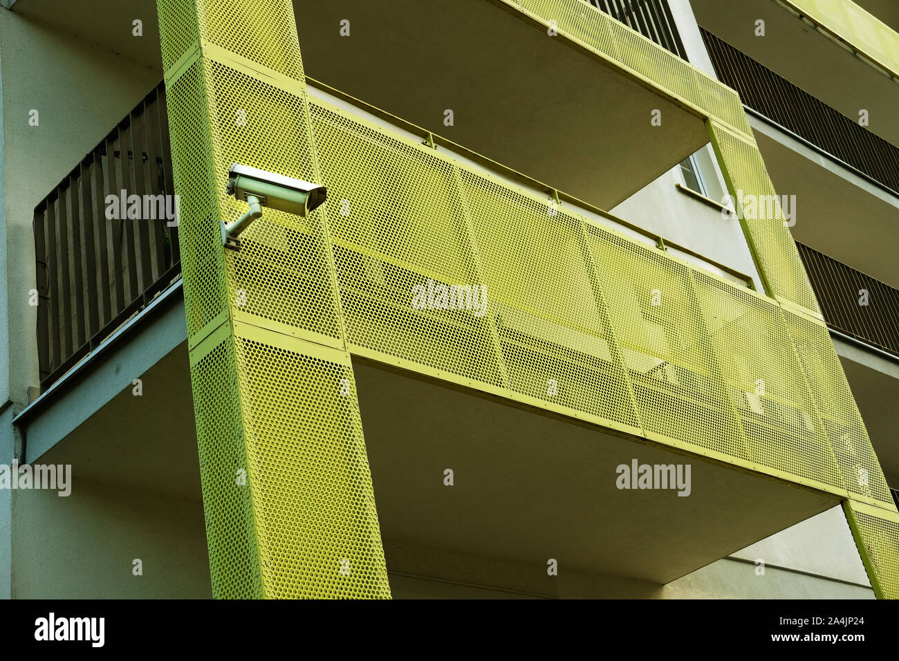security cctv camera installed on a balcony of an apartment building in ...