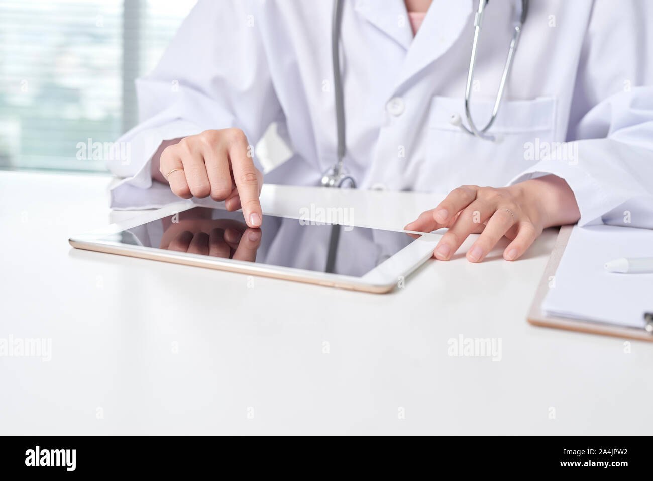Healthcare nurse using smartphone in hi-res stock photography and ...