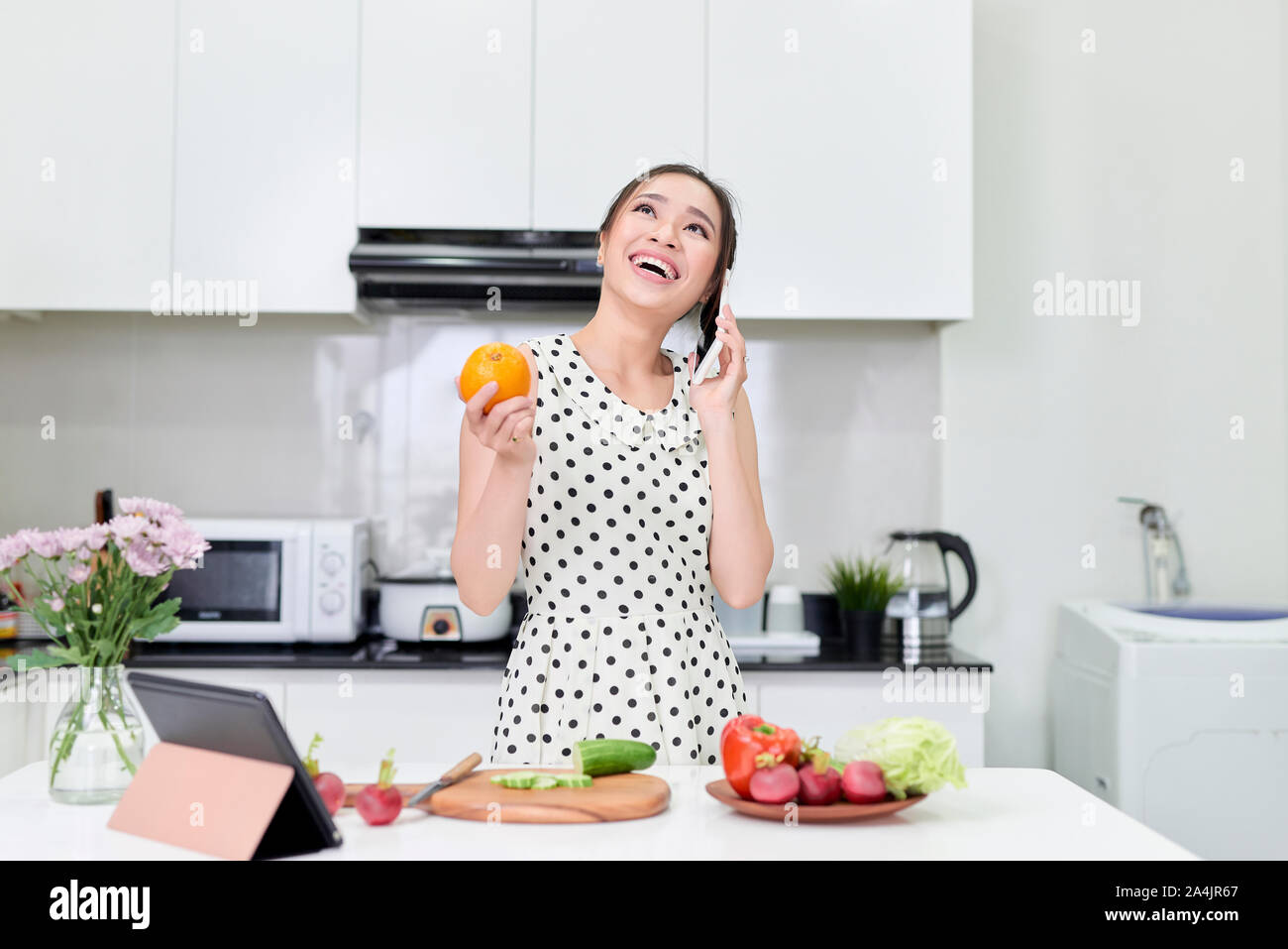 Adult asian woman chopping hi-res stock photography and images - Alamy