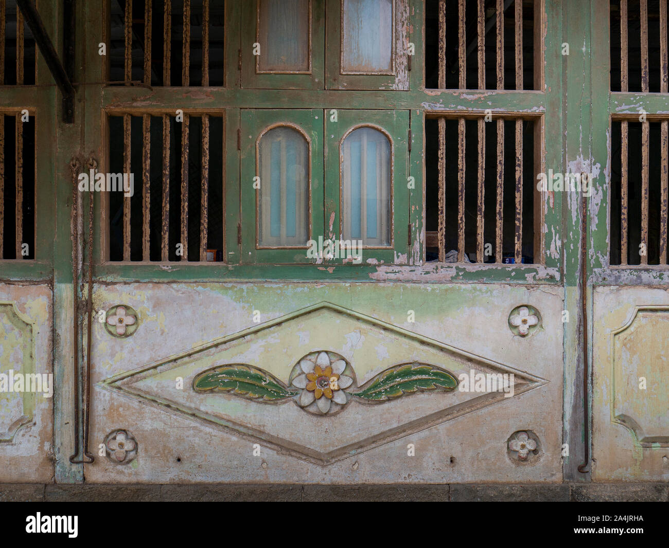 vernacular design wooden window and relief work on wall of Old House ...