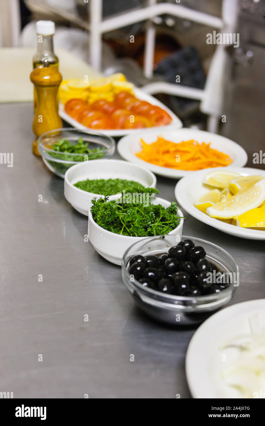 Healthy ingredients on a restaurant kitchen table, ready to go for the ...