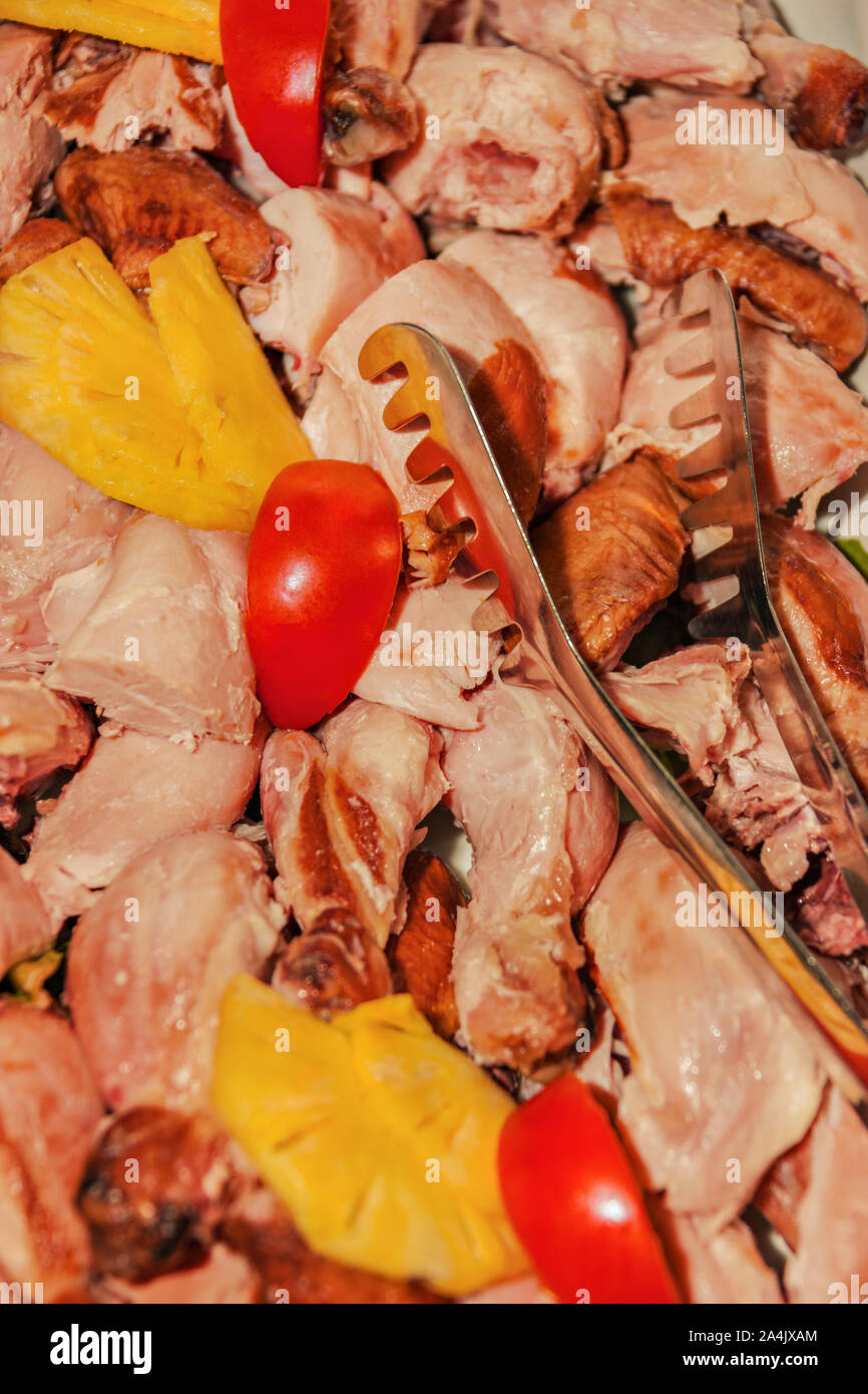 cold meat and chicken wings with tomatoes and pineapple Stock Photo - Alamy