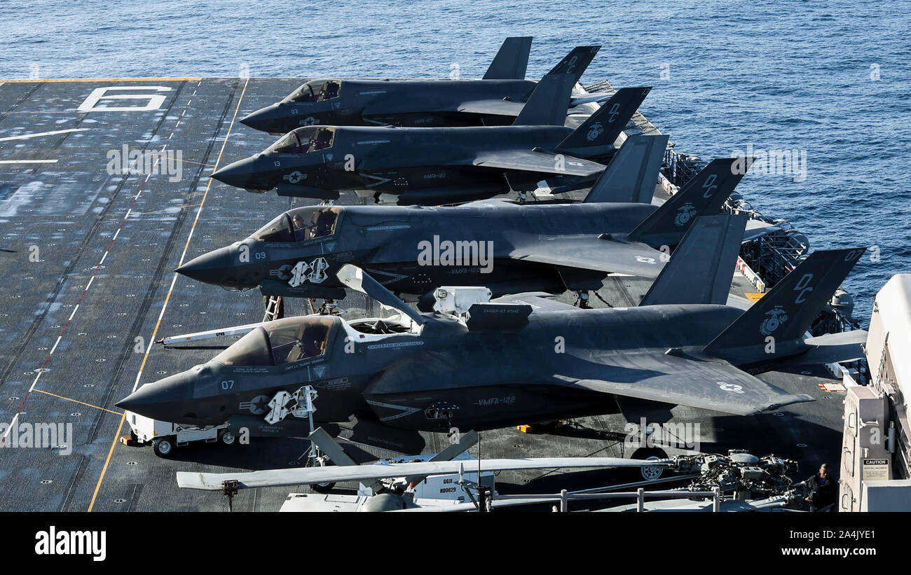 A formation of four U.S. Marine Corps F-35B Lightning IIs with Marine ...
