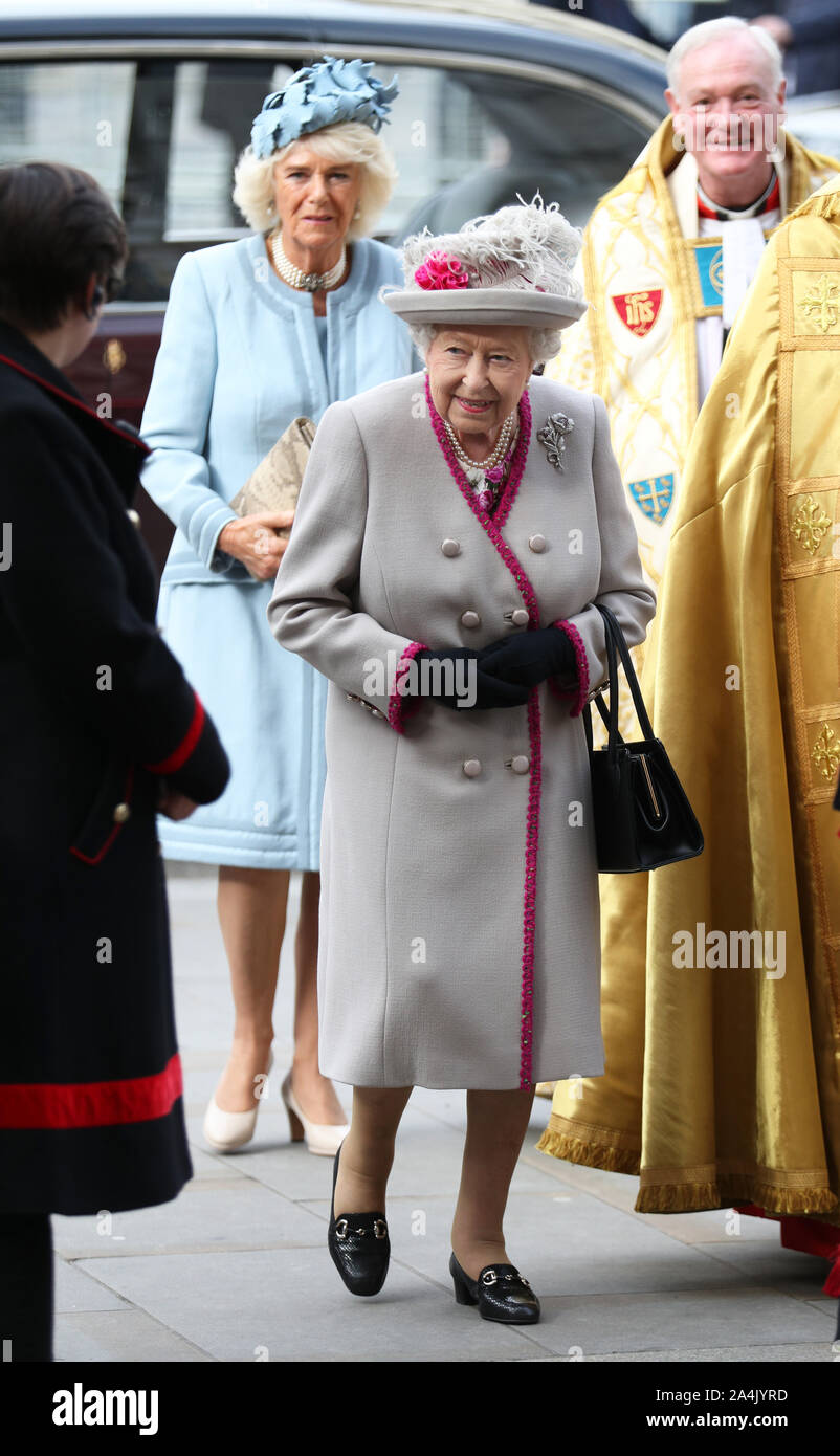 Queen Elizabeth II, accompanied by the Duchess of Cornwall, arrives for ...