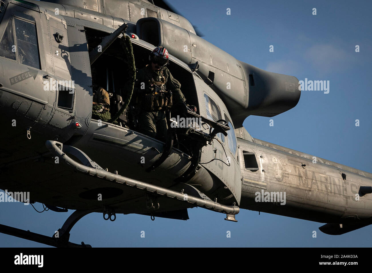 A U.S. Marine Corps Reserve UH-1Y Venom helicopter crew chief with ...