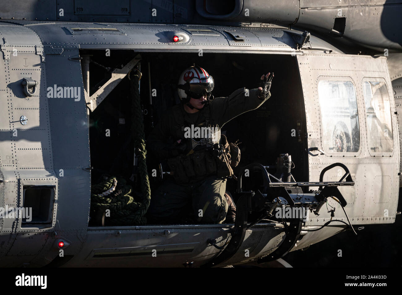 A U.S. Marine Corps Reserve UH-1Y Venom helicopter crew chief with ...