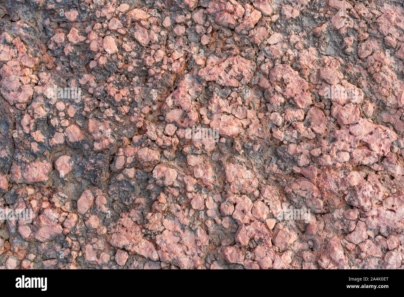 Texture of a pink stone with a rough surface Stock Photo - Alamy