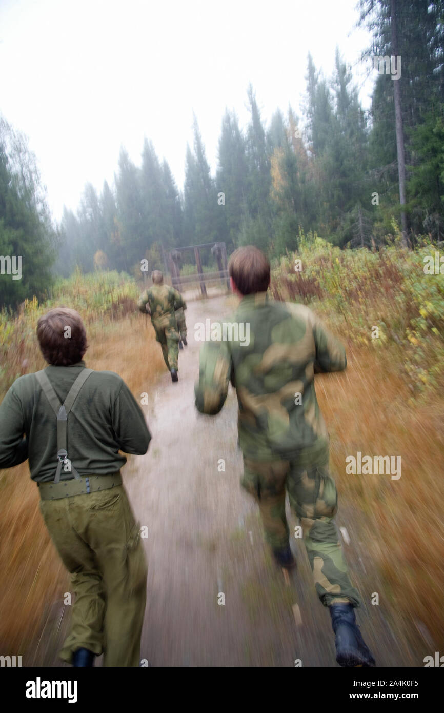 Military exercise in forest. Soldiers running on forest path Stock ...