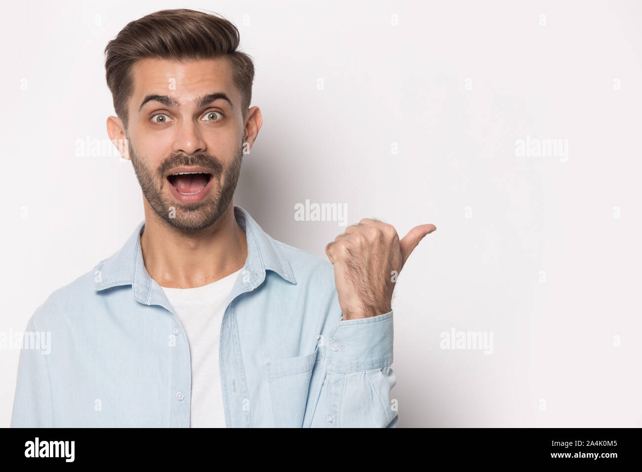 Shocked Caucasian man point at blank copy space Stock Photo - Alamy