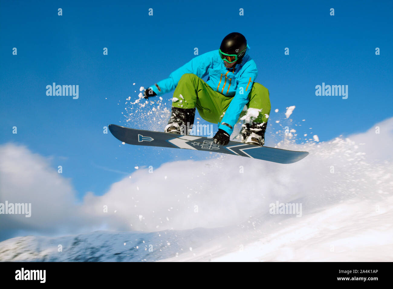 Male snowboarding on mountain, action shot Stock Photo - Alamy
