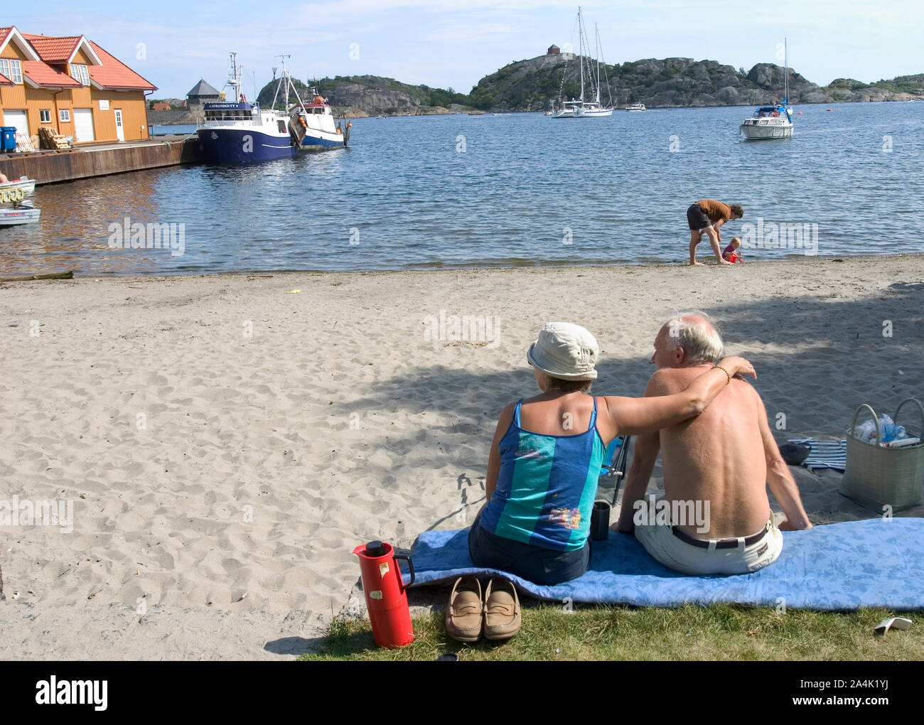 Couple by the sea Stock Photo - Alamy