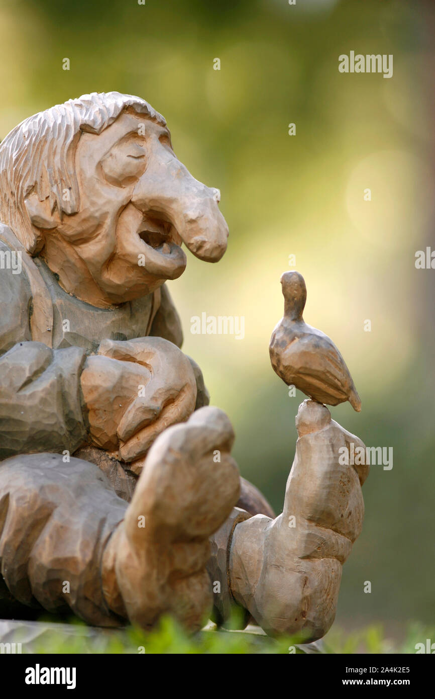 Troll and bird. Wooden sculpture Stock Photo - Alamy