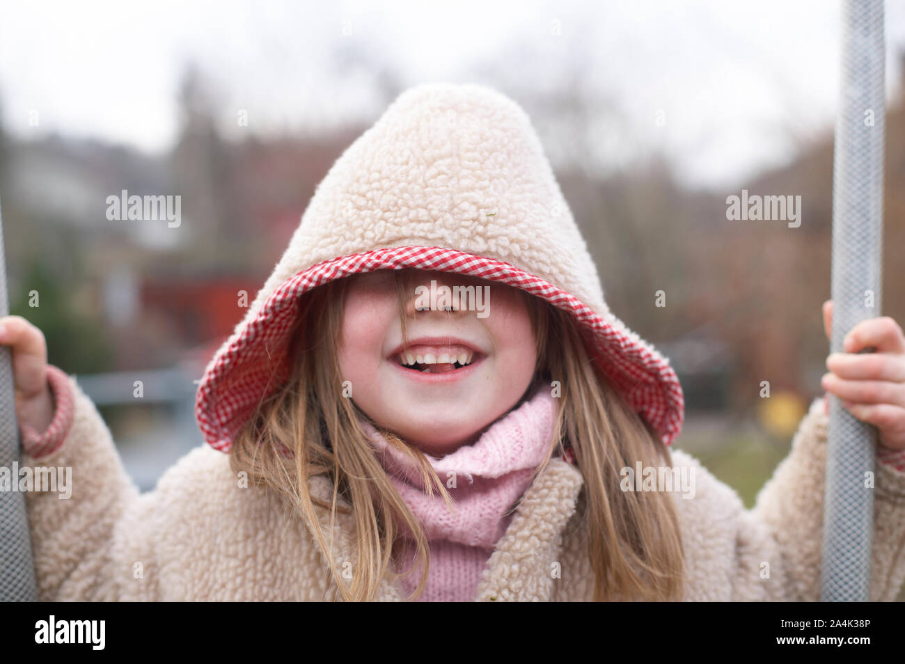 Happy girl with hood Stock Photo - Alamy