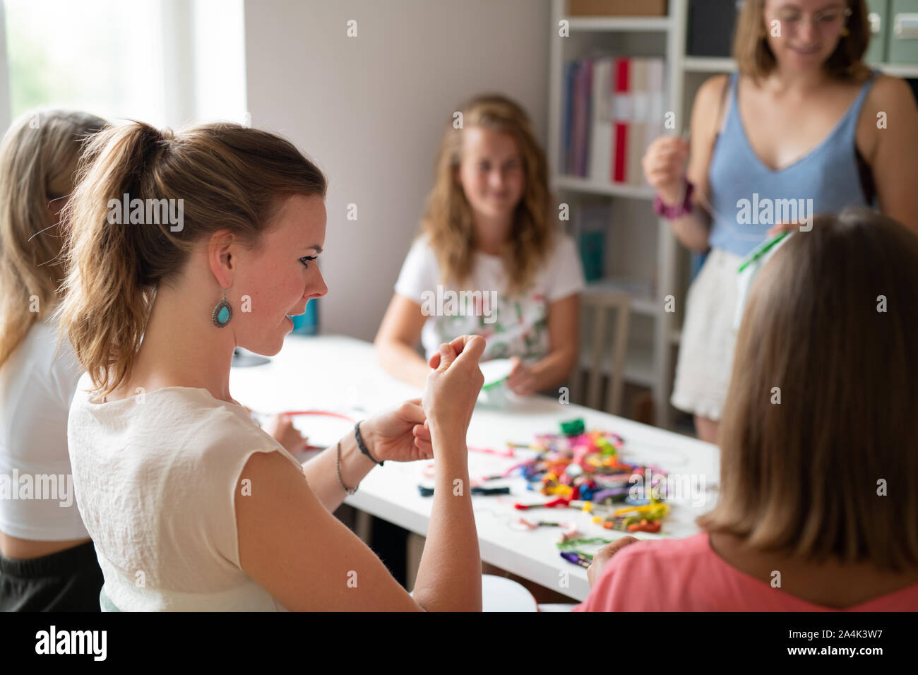 Group of women at a cross-stitching class Stock Photo - Alamy