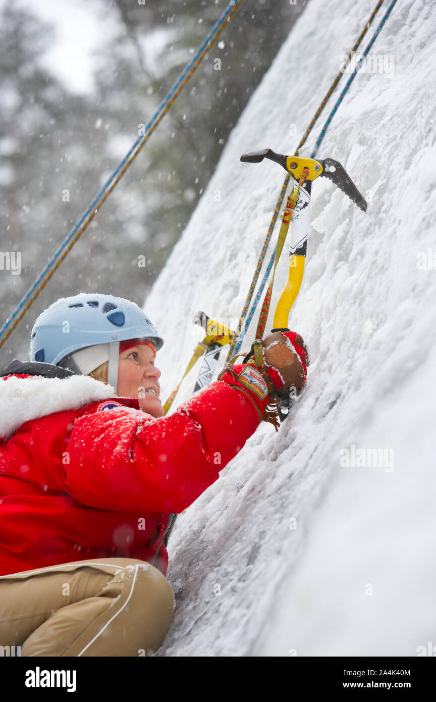 Ice climbing with ice axe Stock Photo - Alamy