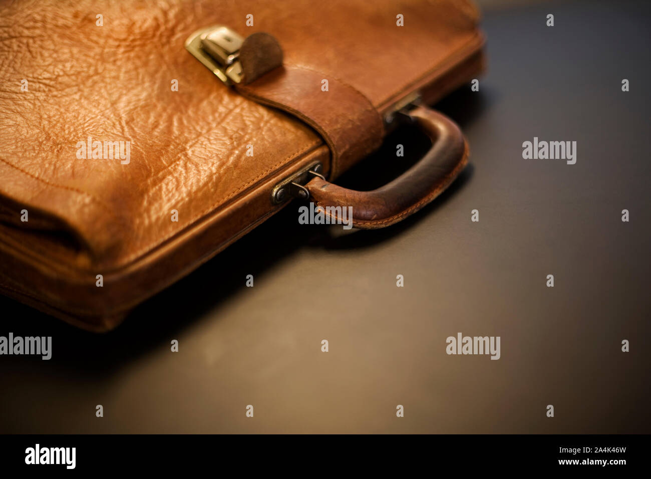 Leather briefcase. Close-up of handle and lock Stock Photo - Alamy