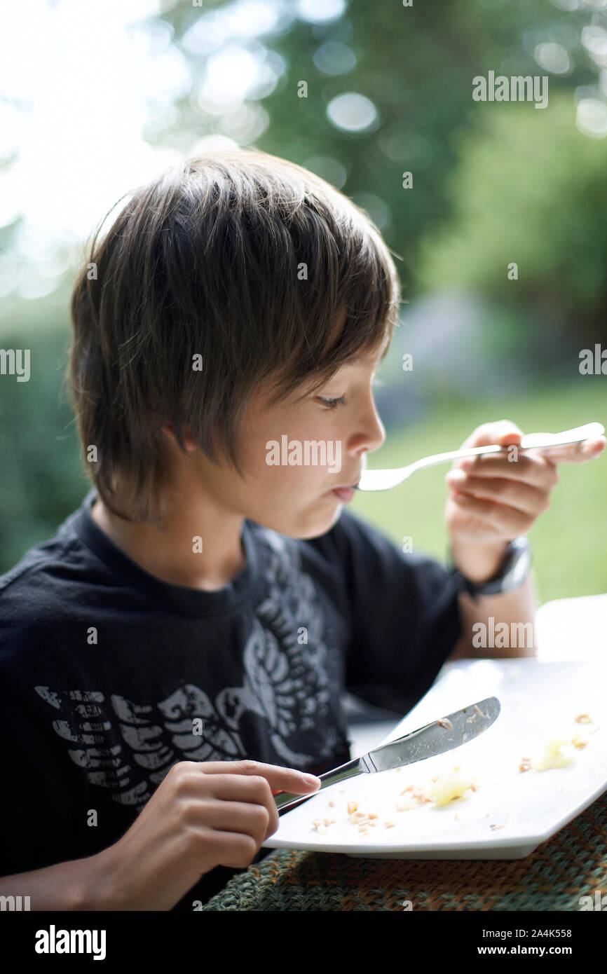Boy By Empty Plate Tasting Taste Stock Photo Alamy