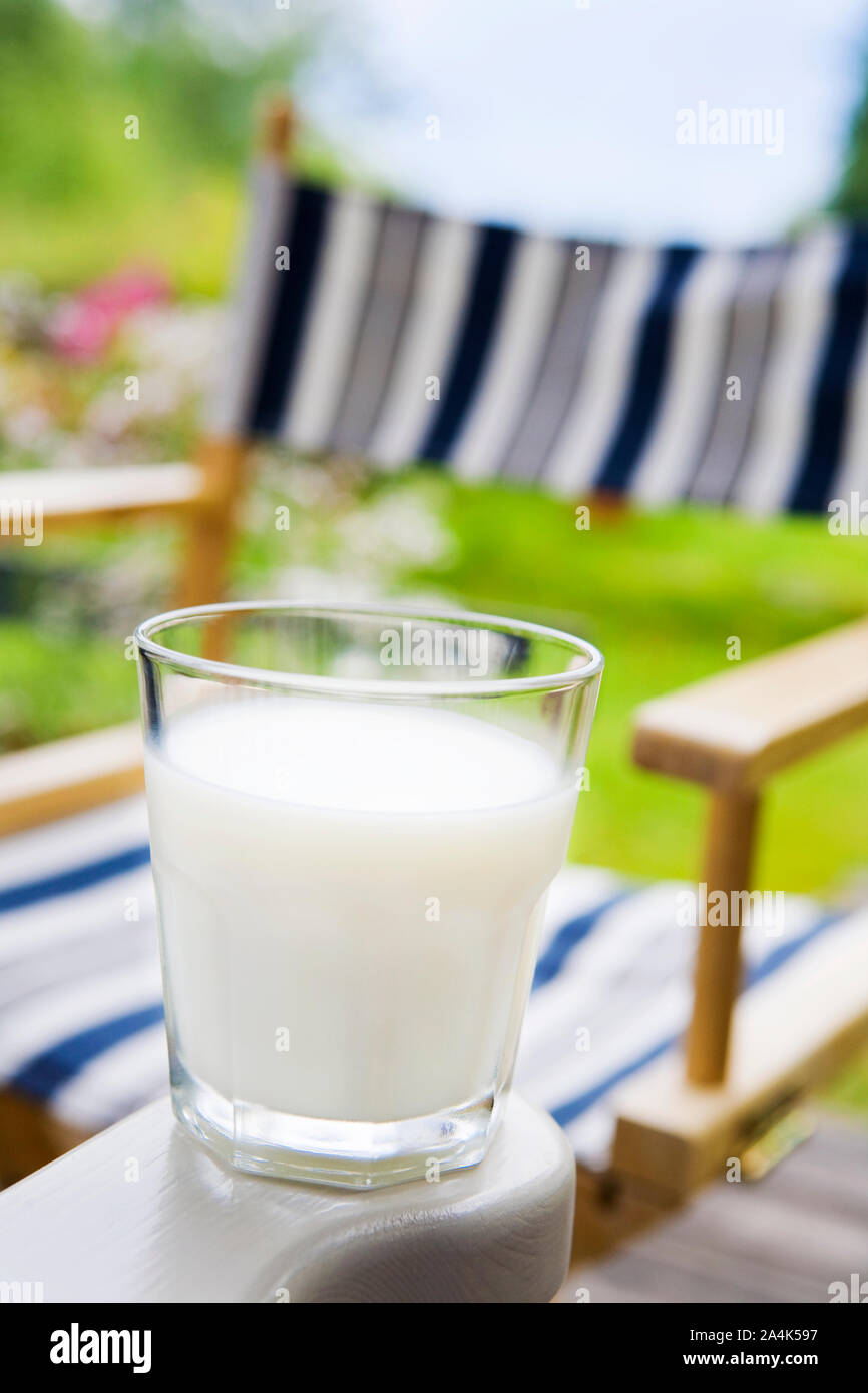 Glass of milk outdoors Stock Photo - Alamy