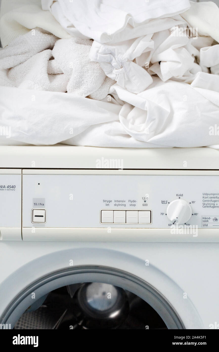 Laundry on washing machine Stock Photo - Alamy