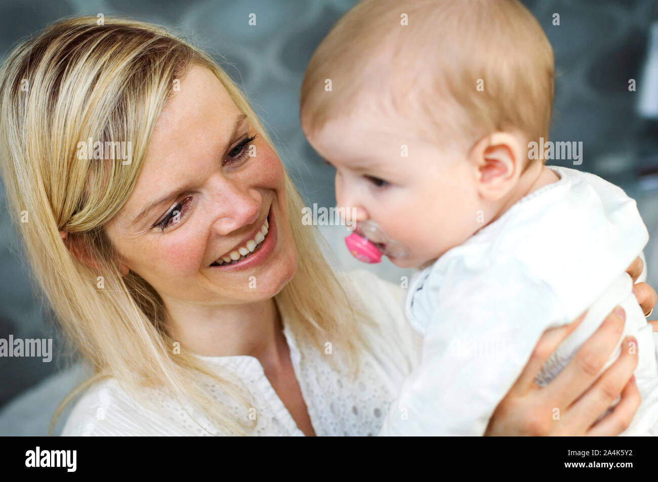 Mother and baby at home Stock Photo - Alamy