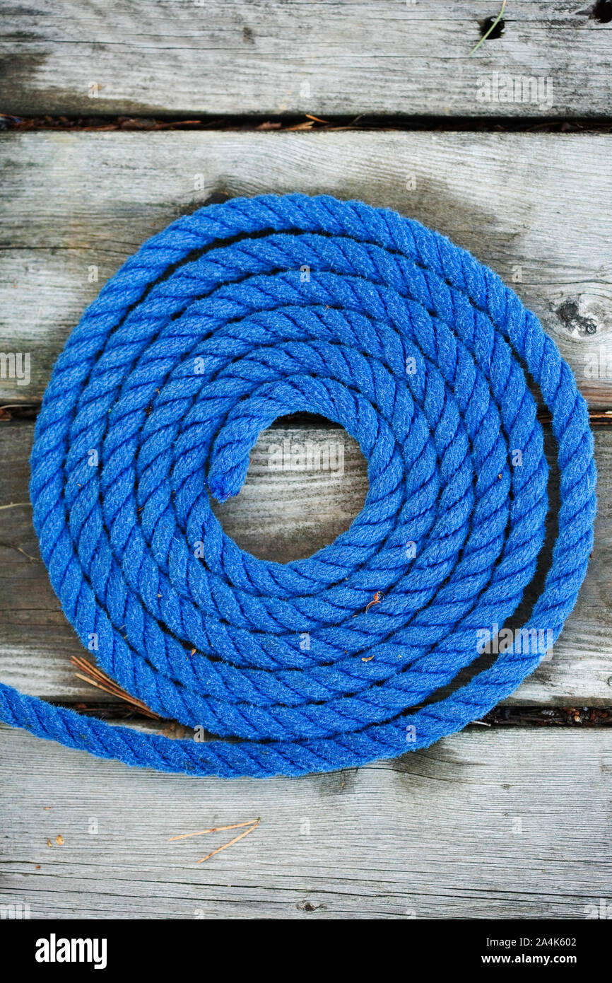 Blue rope on pier Stock Photo - Alamy