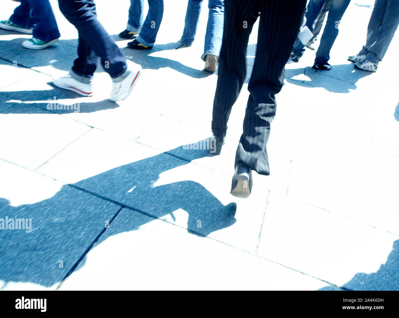 Walking on the pavement Stock Photo - Alamy
