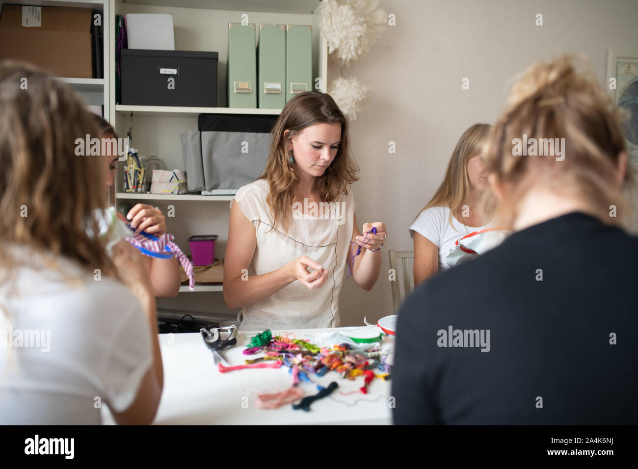 Group of women at a cross-stitching class Stock Photo - Alamy