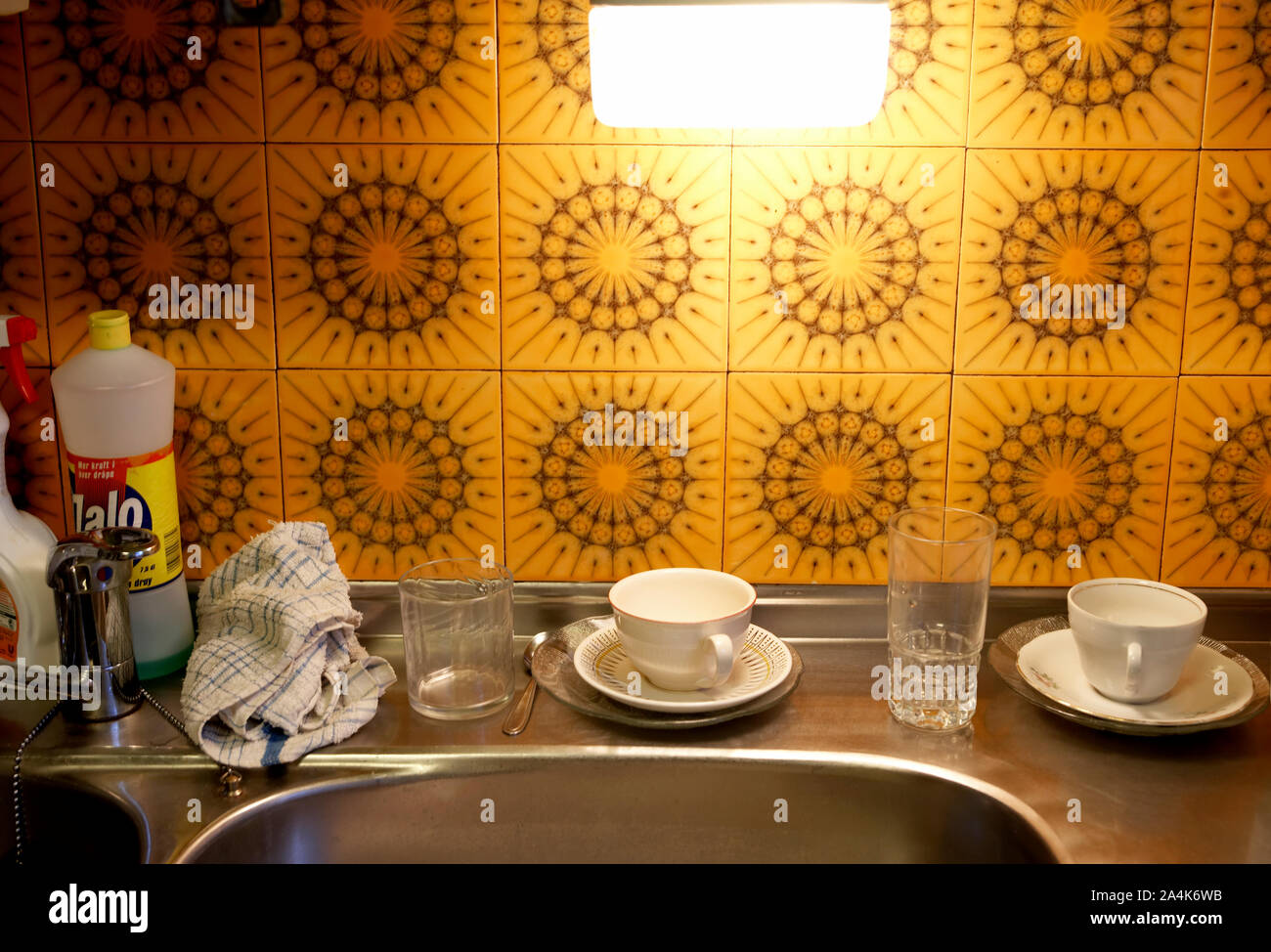 Washing up liquid - beside a cloth - routine Stock Photo - Alamy