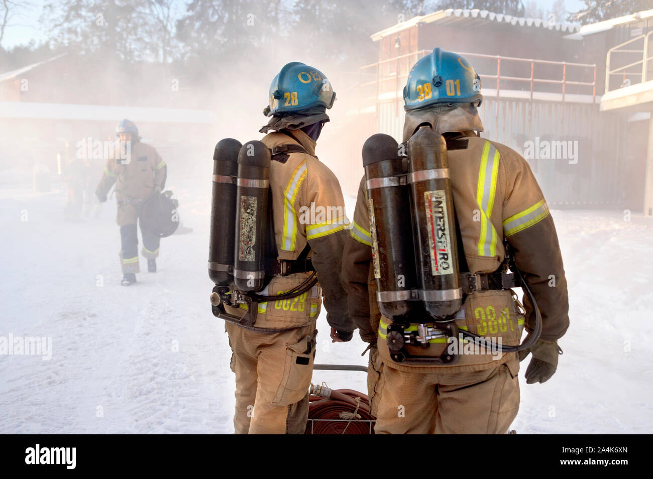 Back view men in helmets hi-res stock photography and images - Alamy
