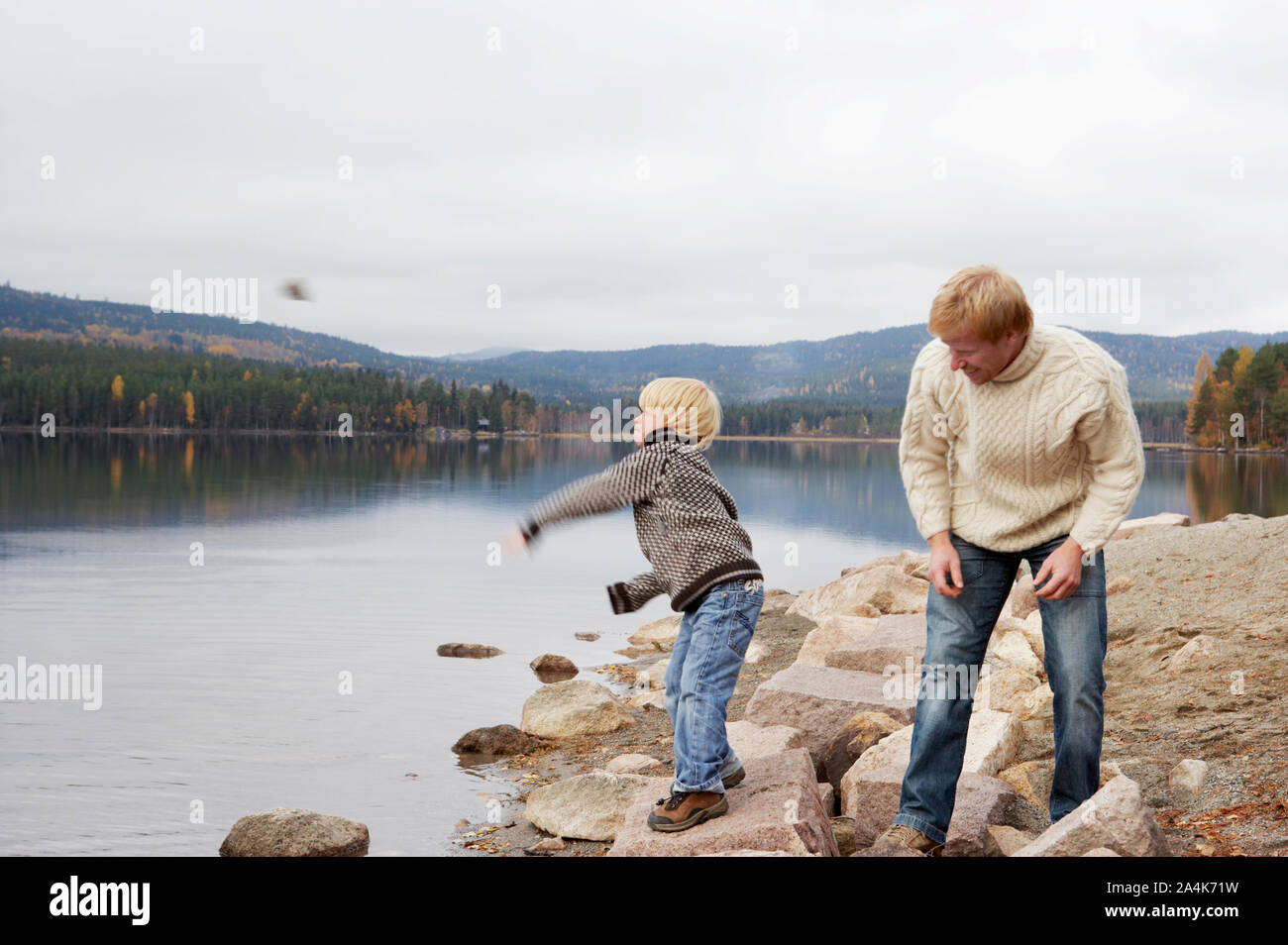 Father and son throwing stones hi-res stock photography and images - Alamy