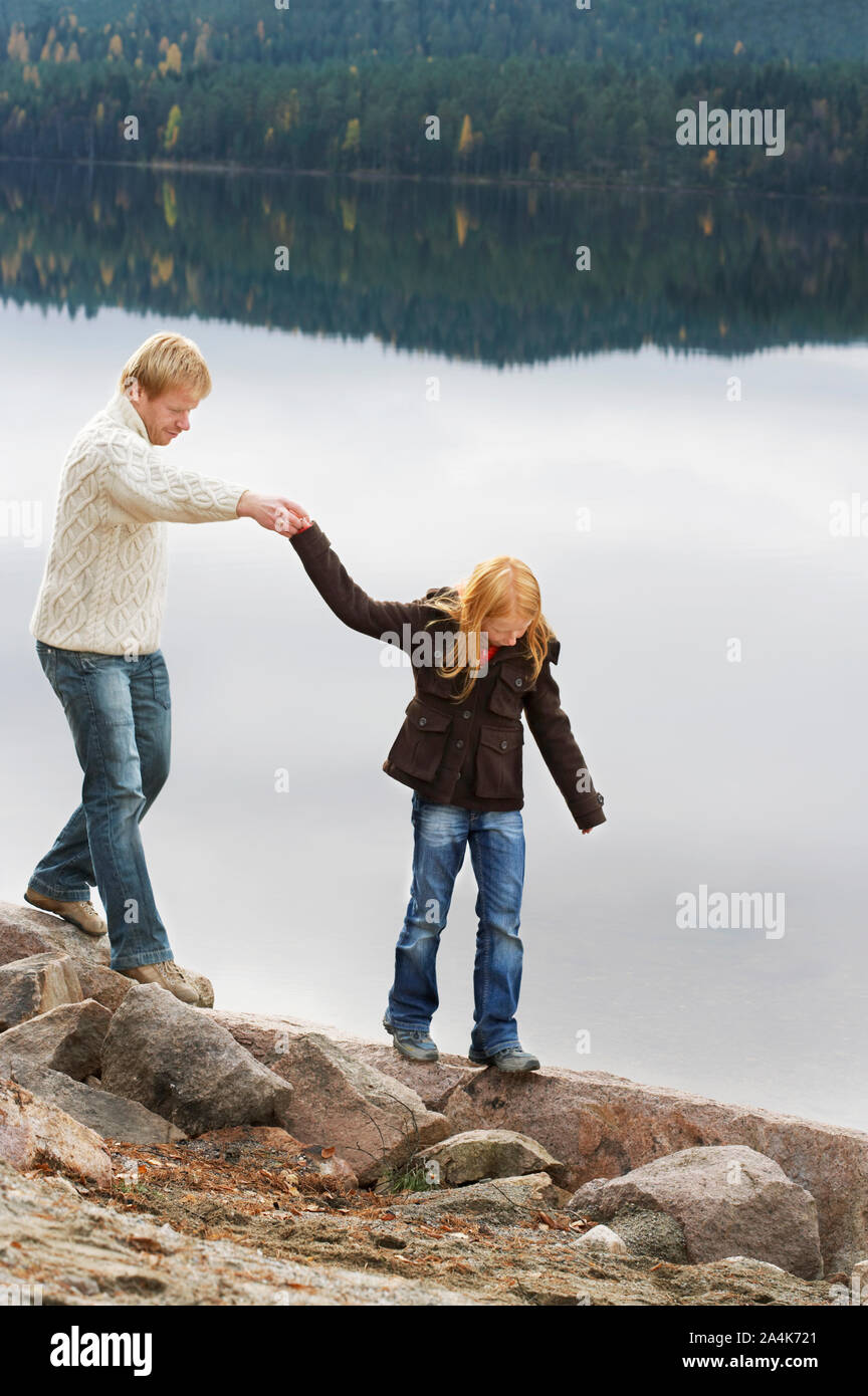 Father giving a helping hand Stock Photo - Alamy