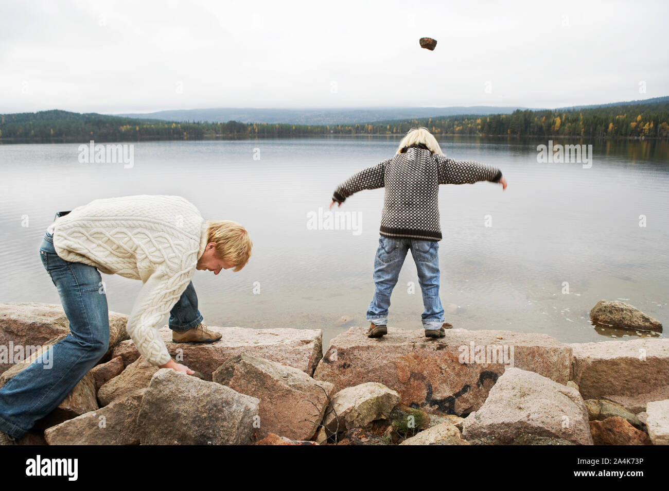 Father and son throwing stones hi-res stock photography and images - Alamy