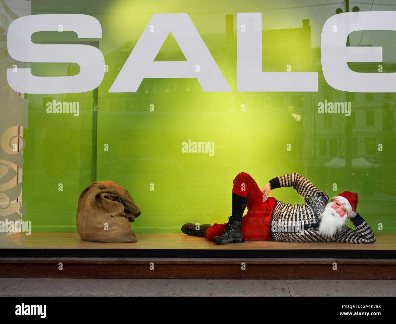 Santa Claus in a shop sale window Stock Photo - Alamy