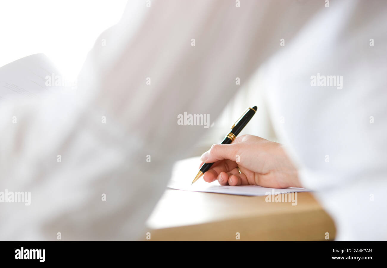 Person writing - author - reading a document - signing a contract Stock ...
