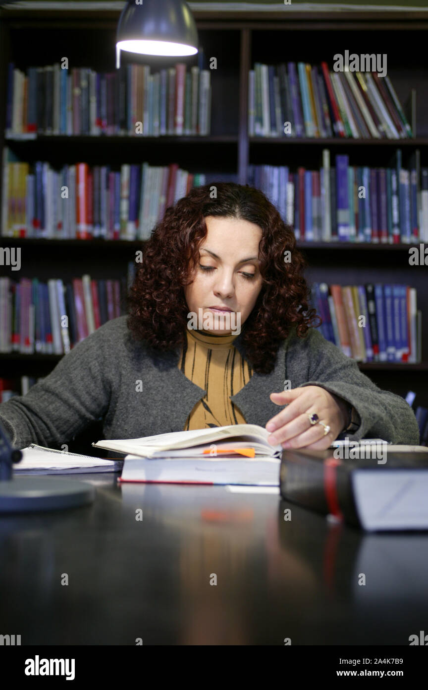 Woman reading a book Stock Photo - Alamy