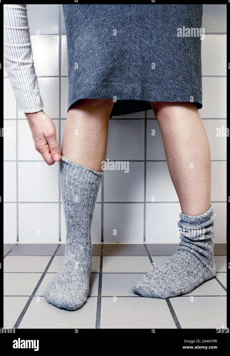 Pulling socks hi-res stock photography and images - Alamy