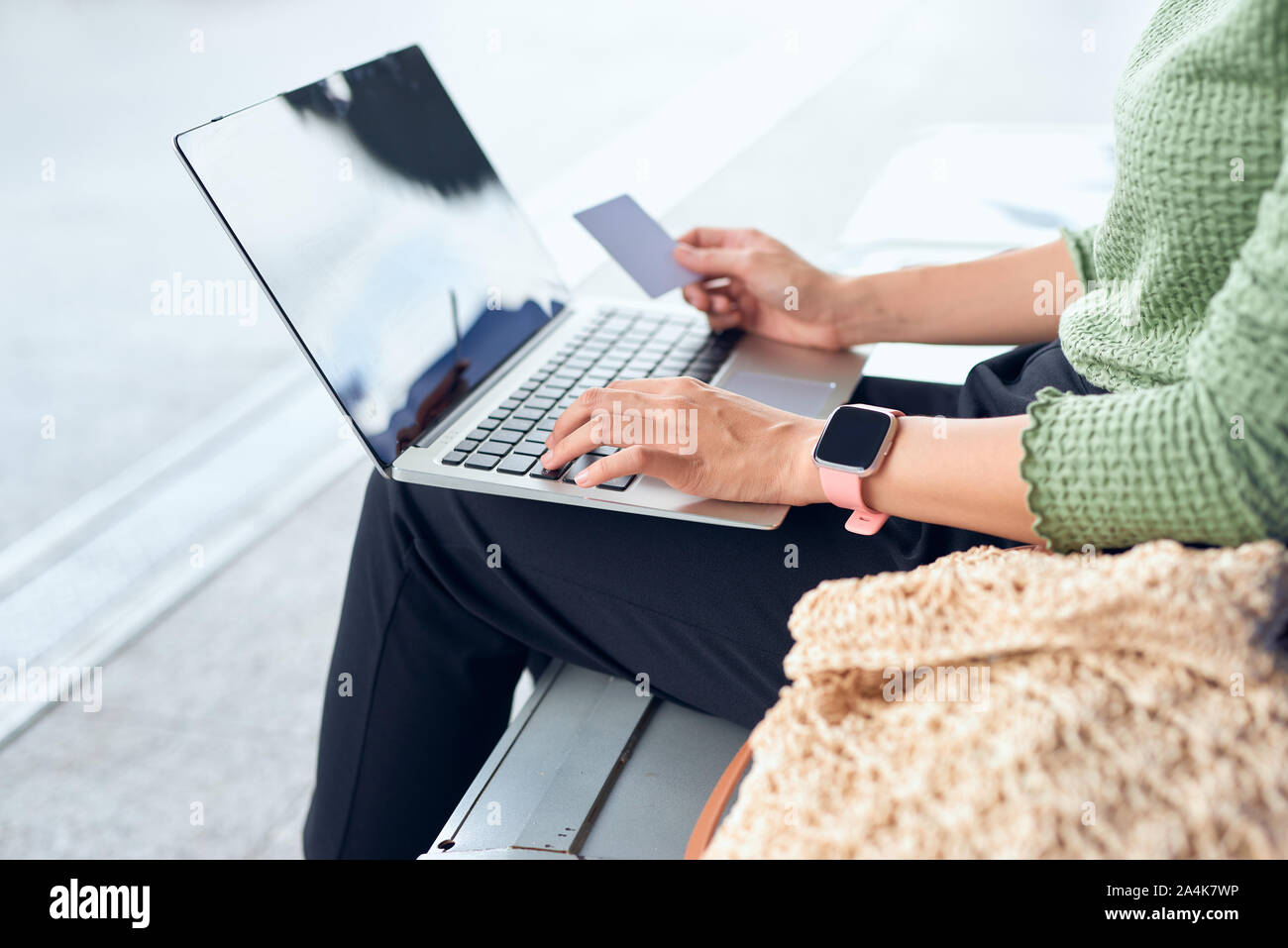Young Asian girls holding credit card and using laptop computer ...