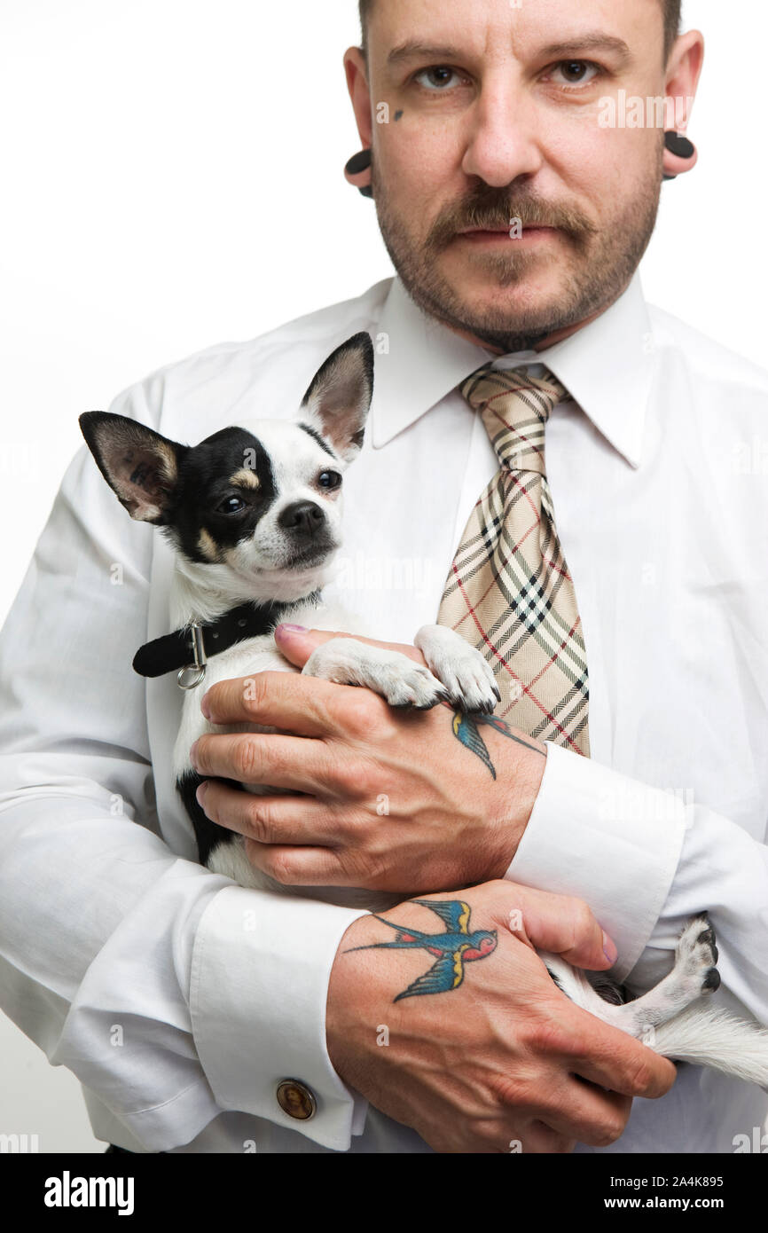 Man holding a sweet small dog Stock Photo - Alamy