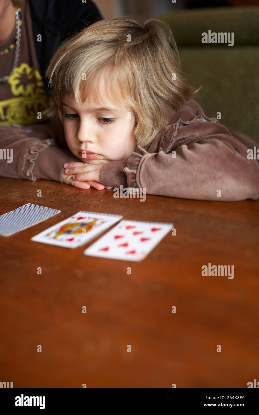 Child playing cards Stock Photo - Alamy