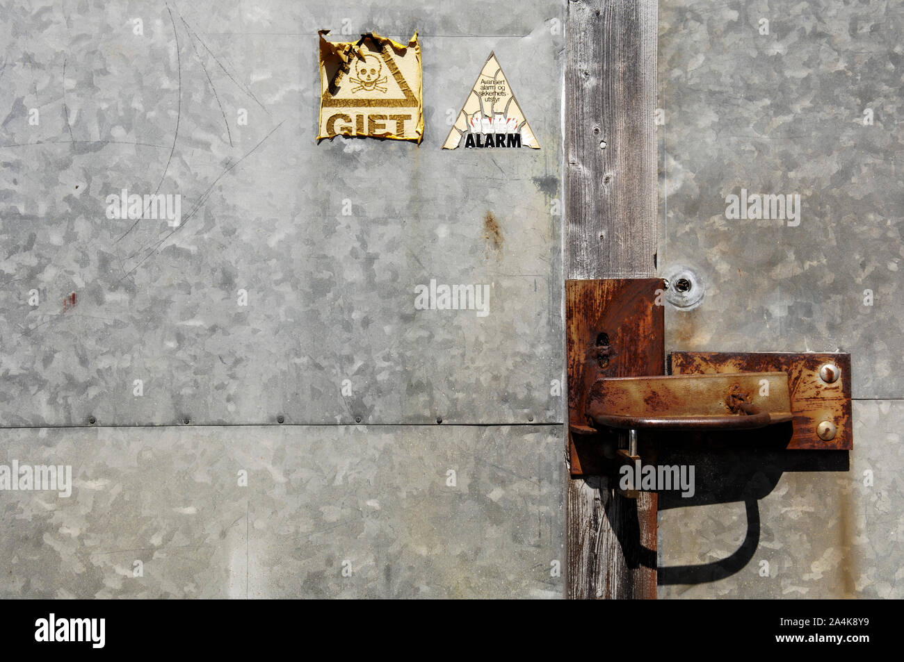 Warning signs on metal door. Poison (gift). Toxic. Danger Stock Photo ...