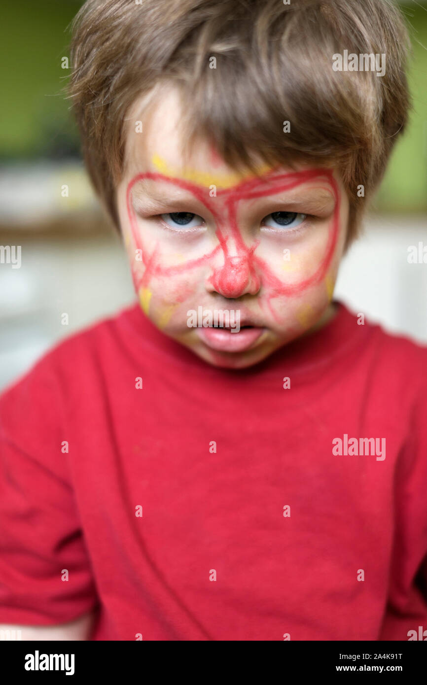 Angry Boy With Painted Face Stock Photo - Alamy