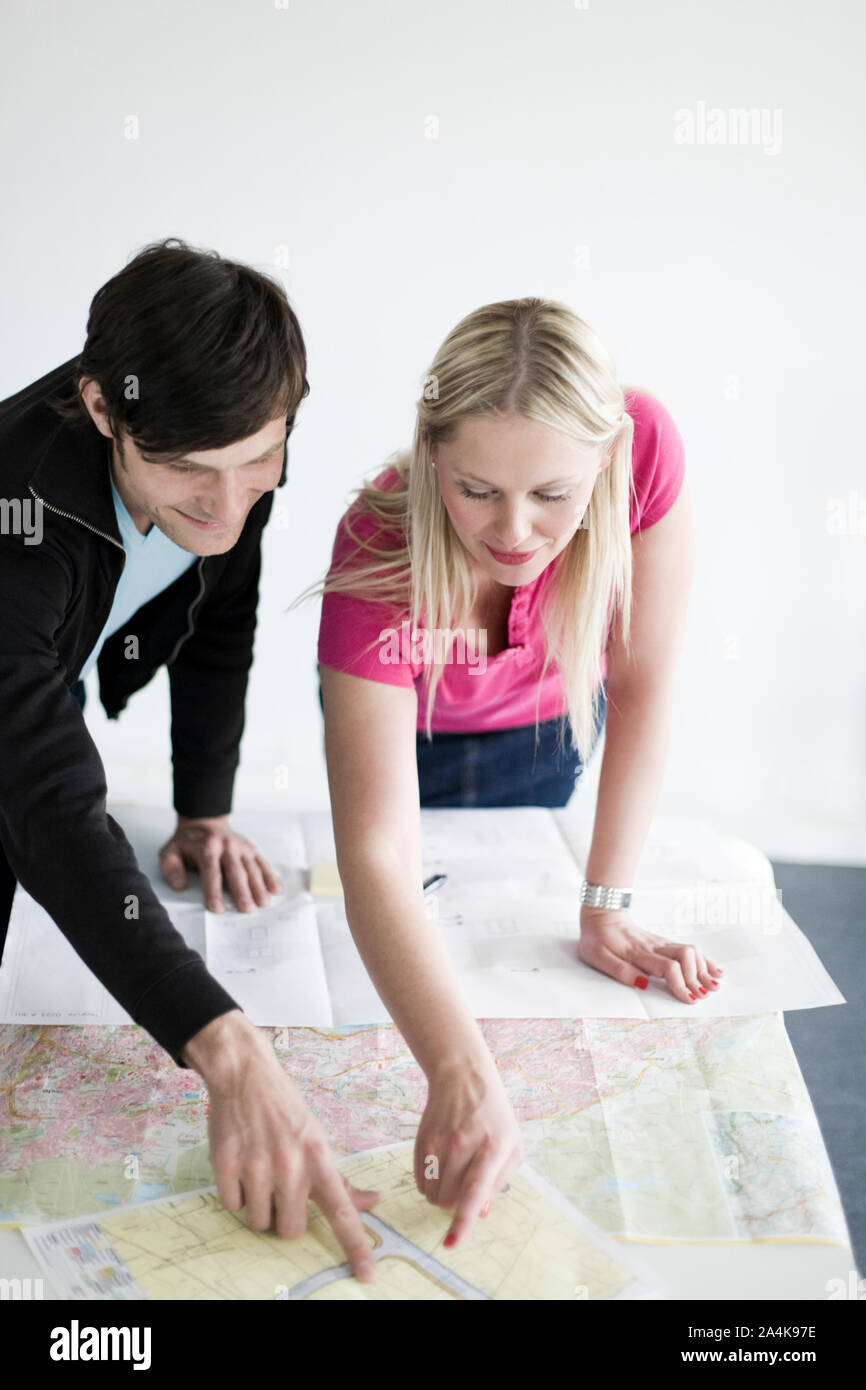 Couple with construction plan, life planning, blueprint - moving ...