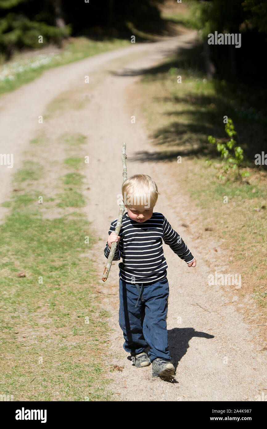 portrait of boy walking on path Stock Photo - Alamy