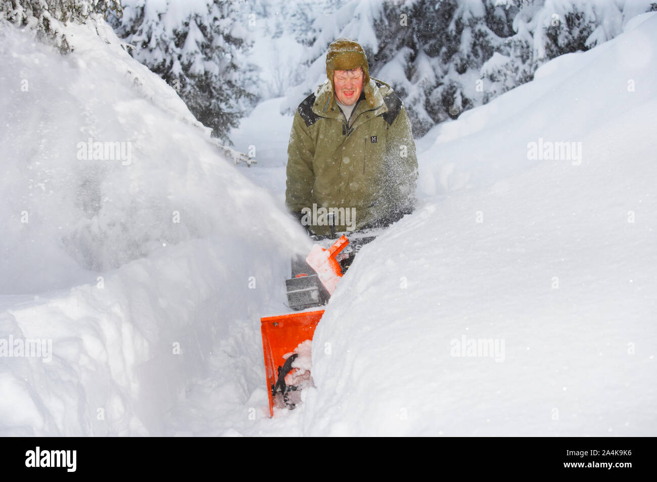 Man clearing snow Stock Photo - Alamy