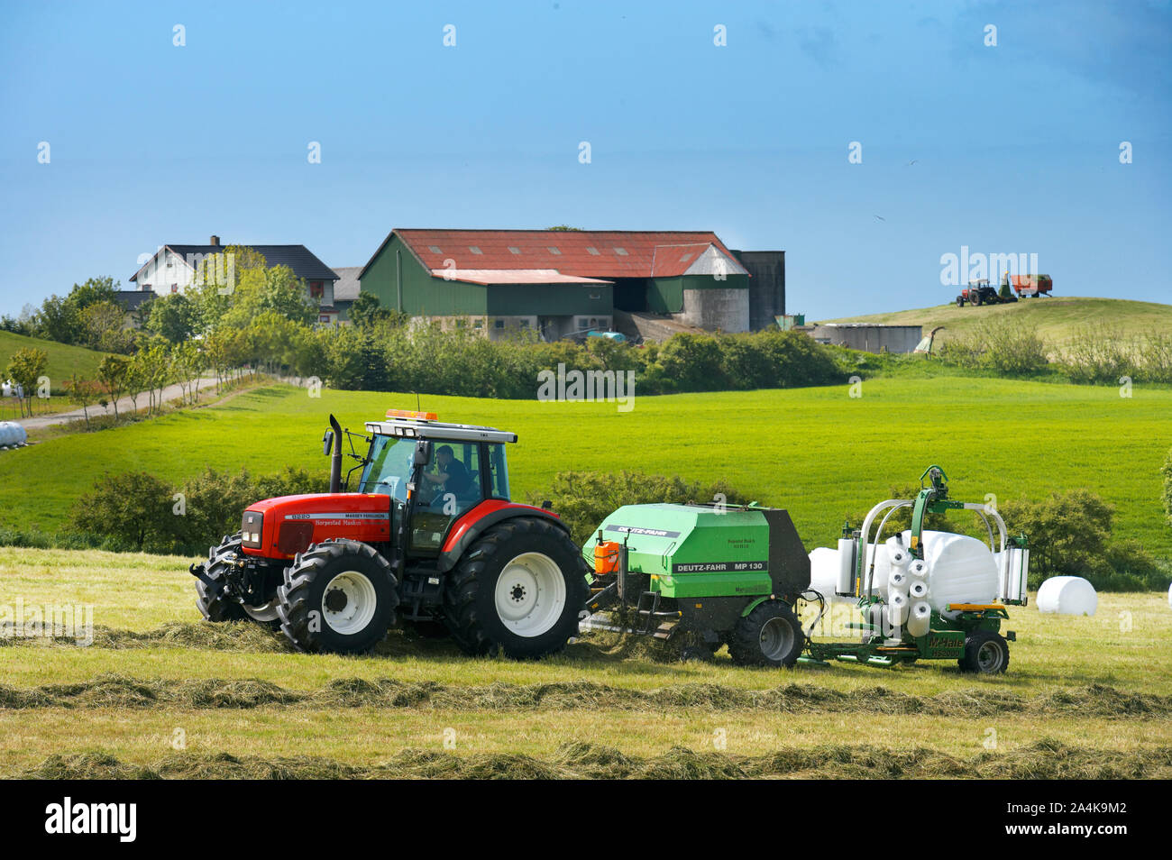 Norwegian farm and tractor Stock Photo - Alamy