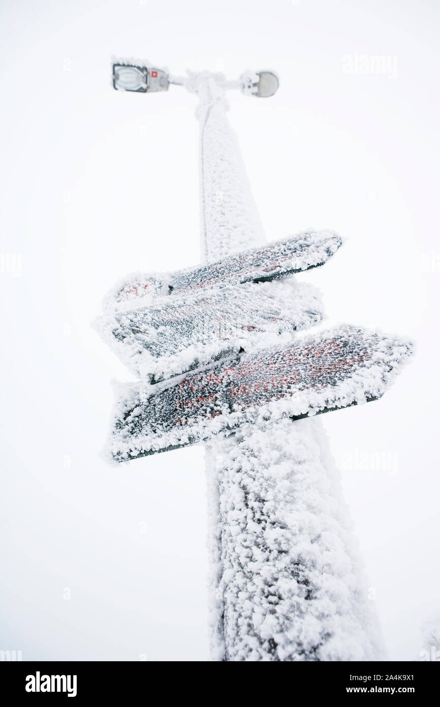 Road sign on lampost covered in snow Stock Photo - Alamy