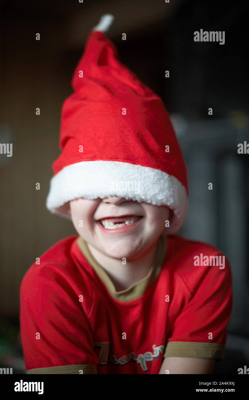 Boy wearing santa hat Stock Photo - Alamy