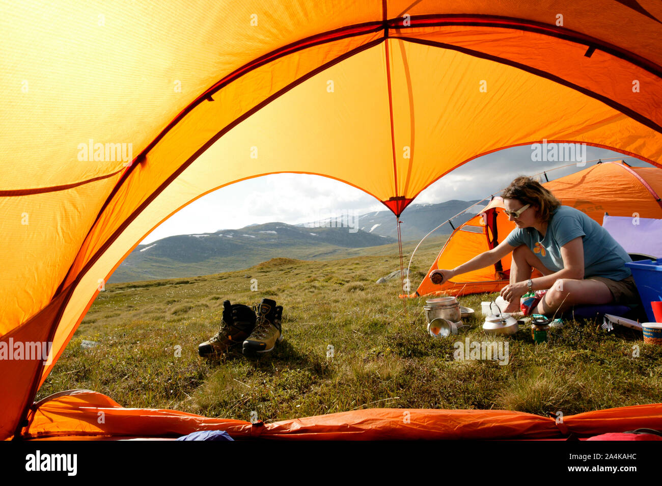 Hikers camping on hill Stock Photo - Alamy