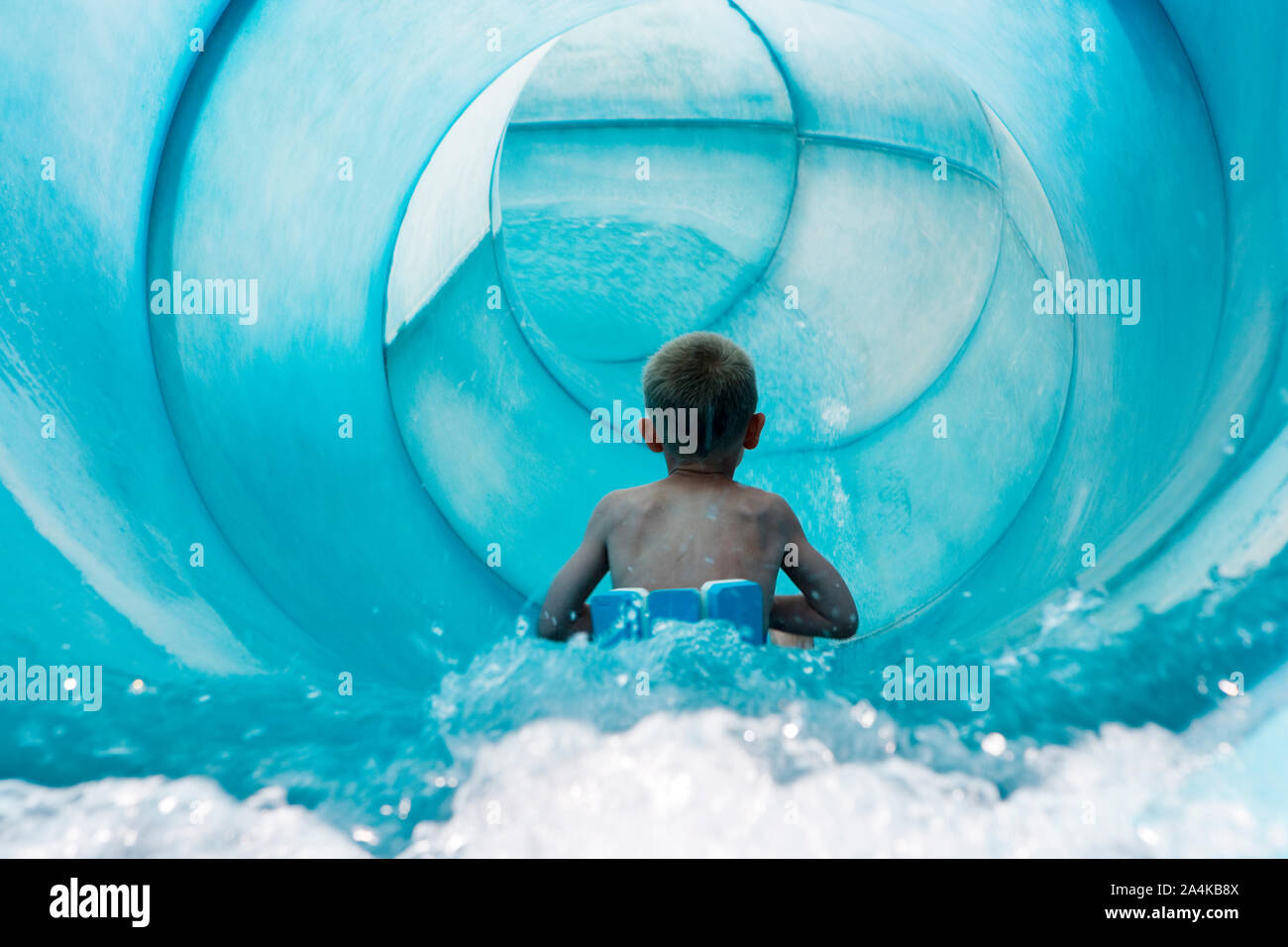 Boys water slide hi-res stock photography and images - Alamy